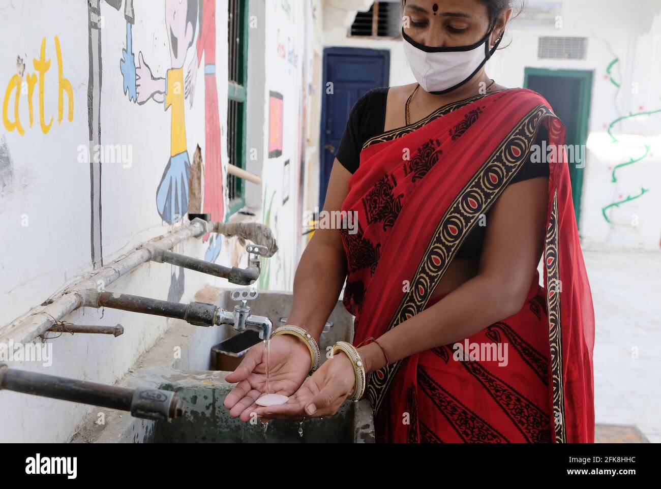 Indian female washing her hands during the COVID-19 pandemic Stock ...