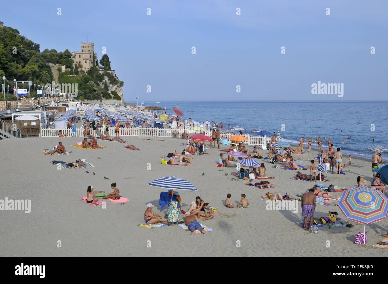 sunbathers on the beach of Finale Ligure, Liguria, Italy Stock Photo ...