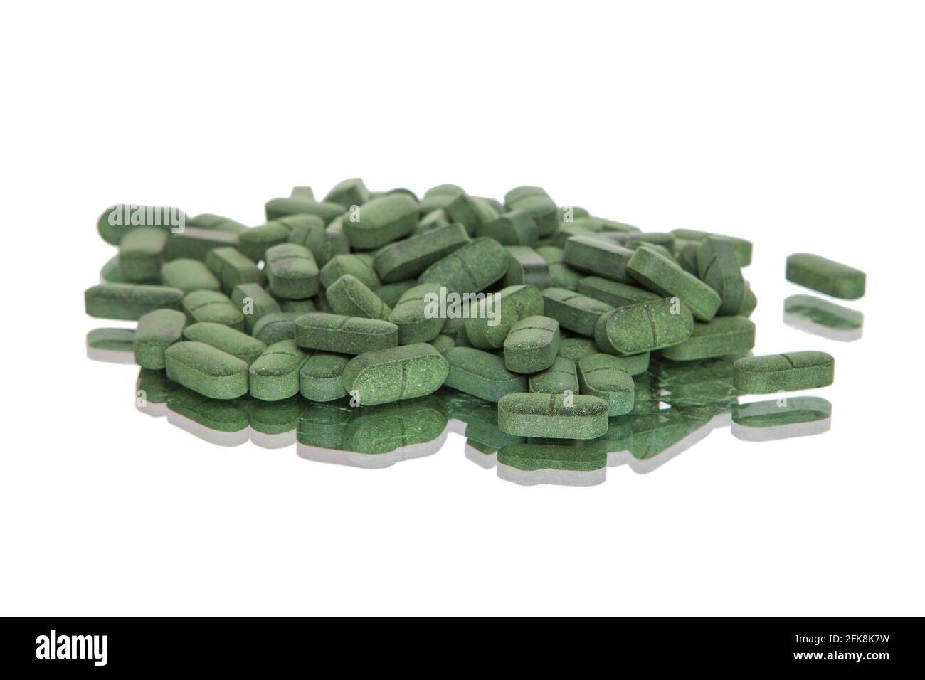 Green herbal pills, vitamin - isolated on white background Stock Photo ...