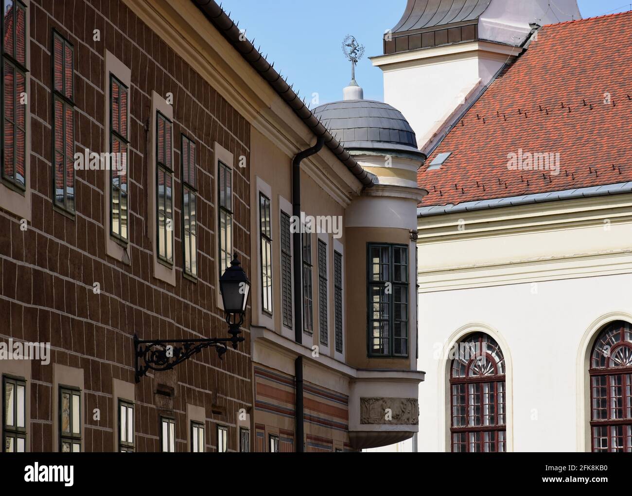 Urban street scene with old residential building facade and church ...