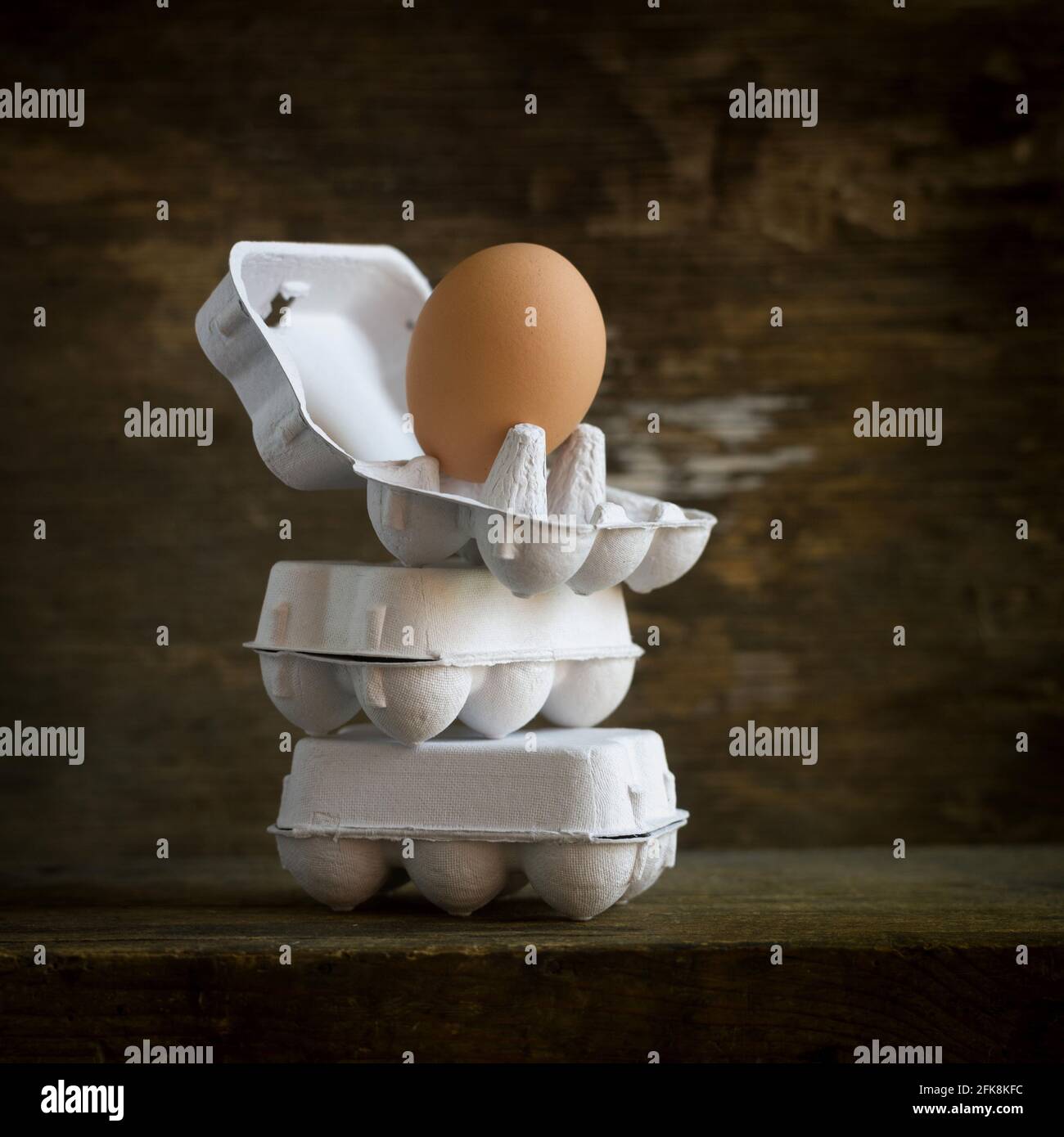 Single egg in egg cartons stacked on each other Stock Photo - Alamy