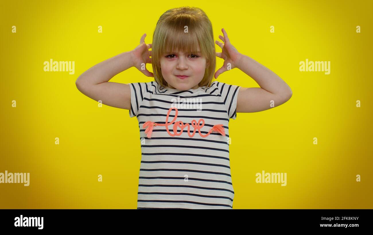 Dissatisfied blonde child girl expressing disbelief irritation, feeling ...