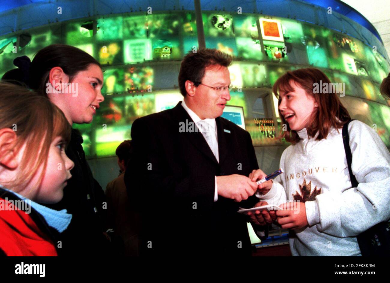 PY GERBEAU DOME CHIEF EXECUTIVE SIGNS AN AUTOGRAPH JULY 2000FOR A YOUNG ...