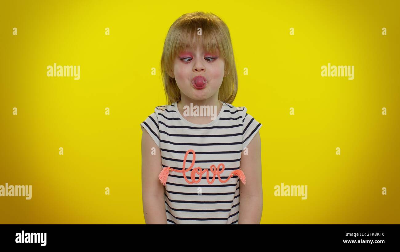 Funny child kid girl making playful silly facial expressions and ...