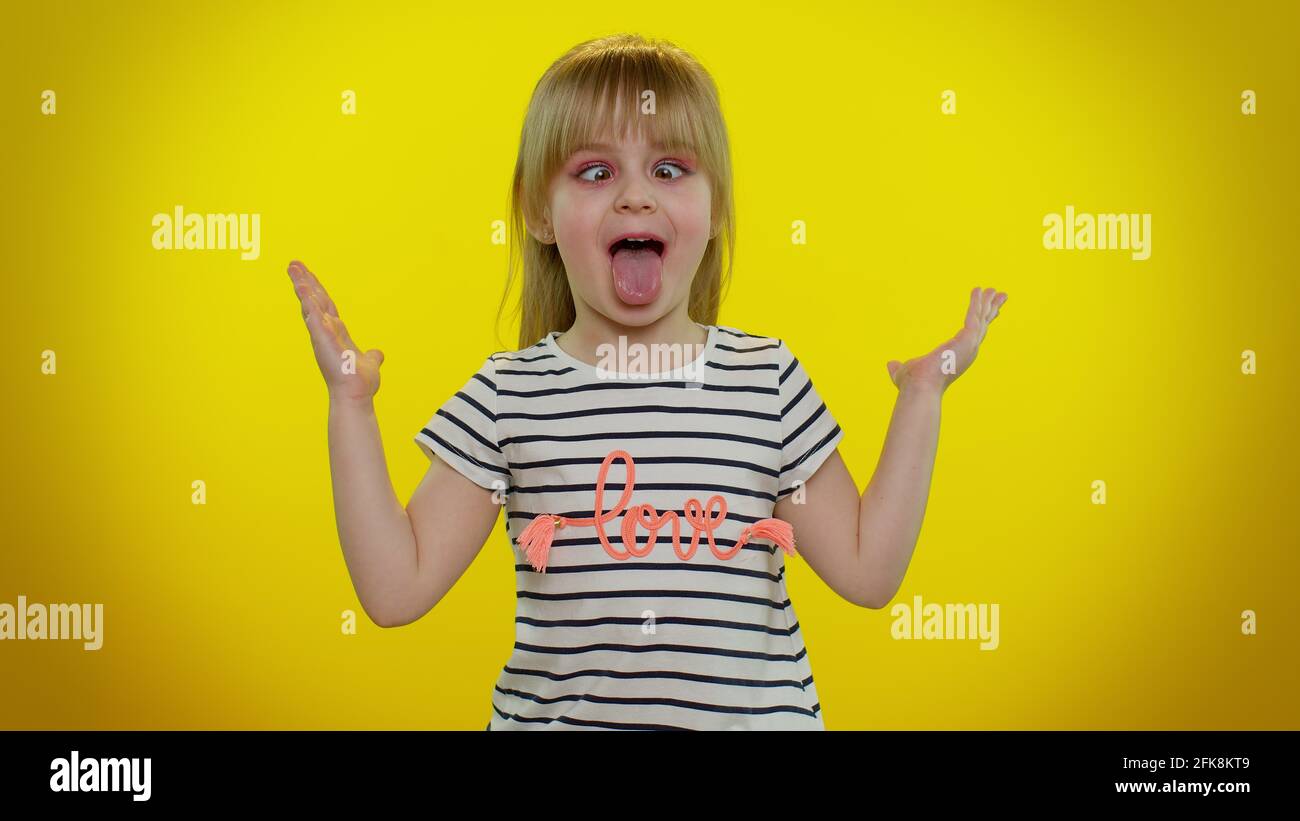 Funny child kid girl making playful silly facial expressions and ...