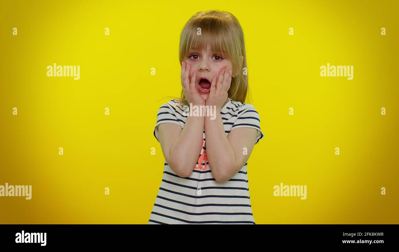 Scared fearful kid child expresses his fear and waves his hands away ...