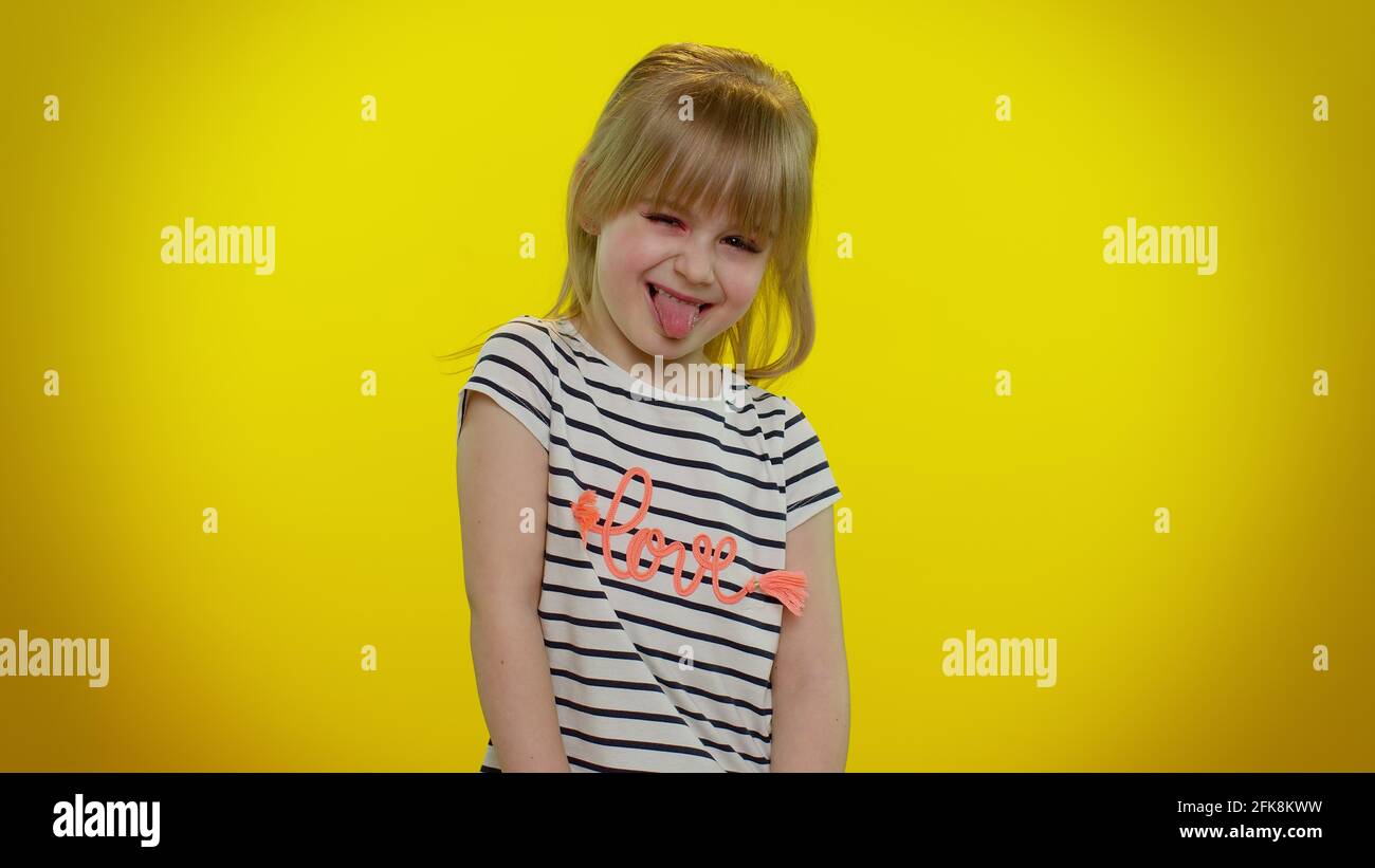 Funny child kid girl making playful silly facial expressions and ...