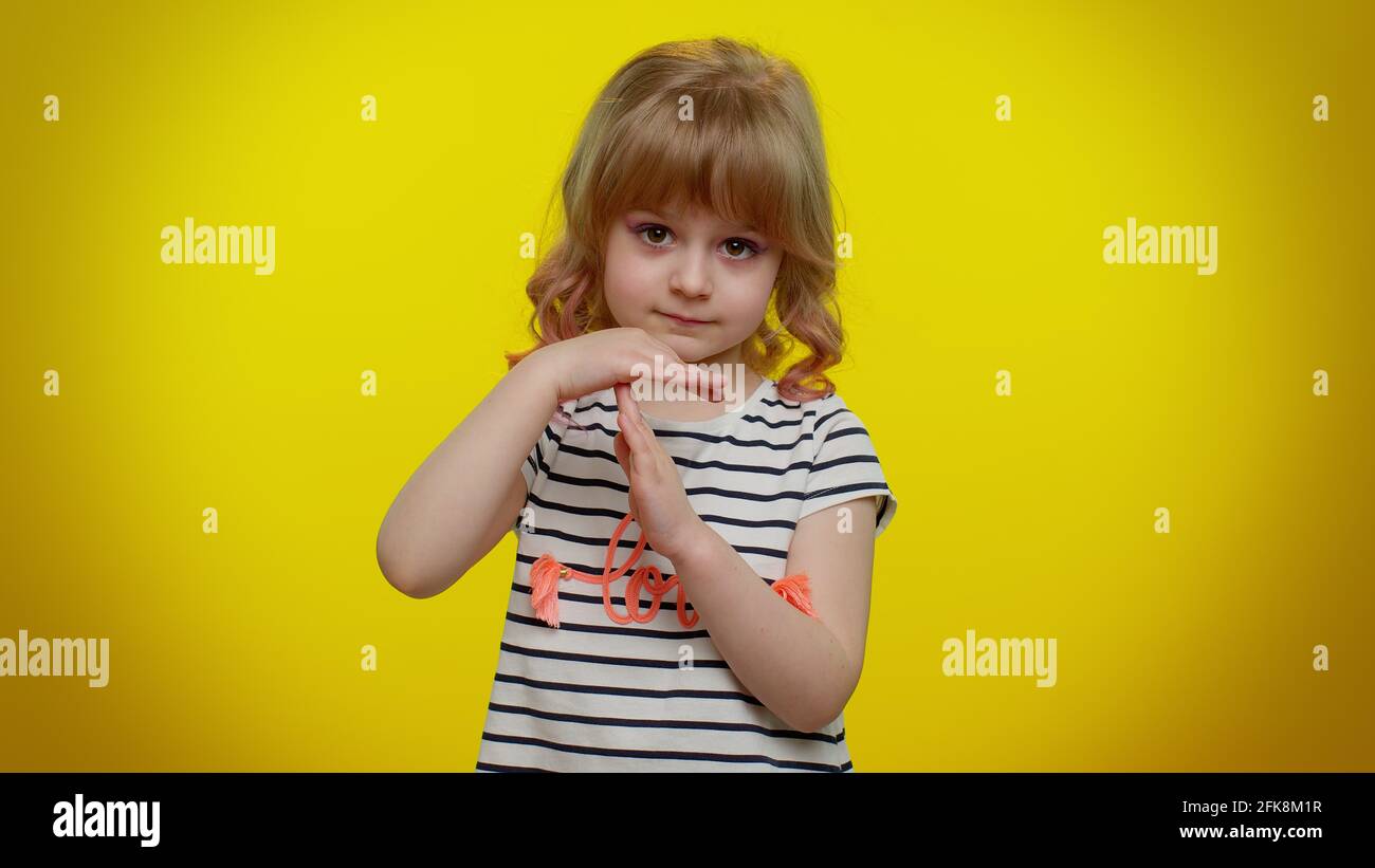 Serious blonde child girl showing time out gesture, limit or stop sign ...