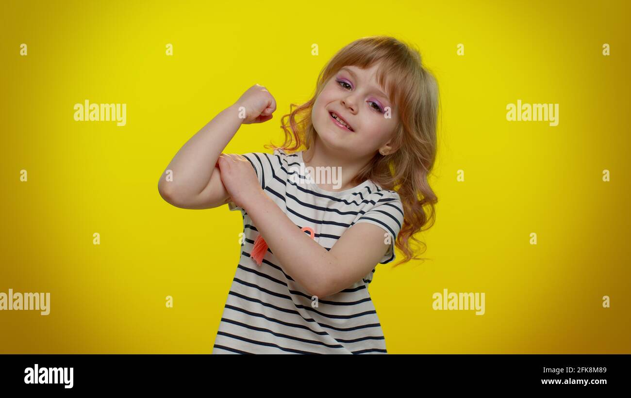 Little strong kid child girl showing biceps and feeling power strength ...