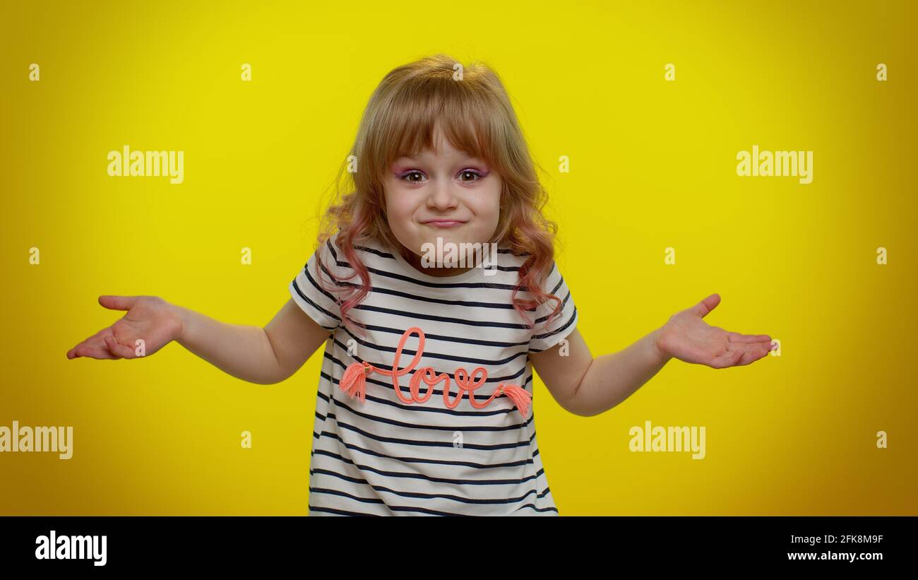 Puzzled clueless uncertain blonde kid child raising hands in helpless ...