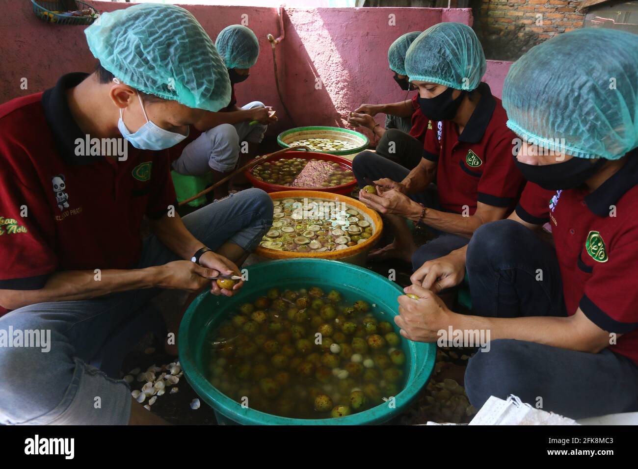 workers make a syrup drink from nutmeg Stock Photo - Alamy