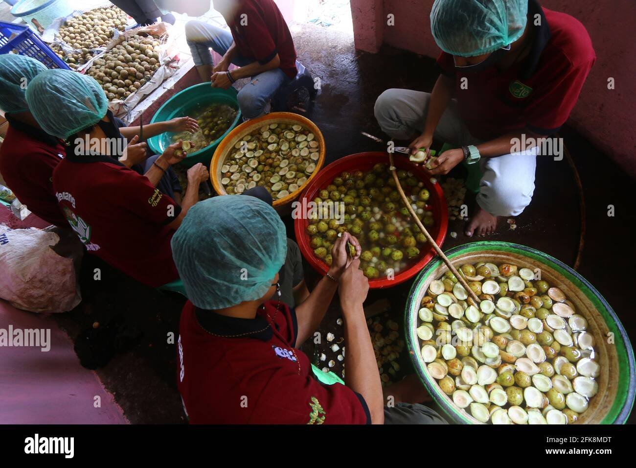 workers make a syrup drink from nutmeg Stock Photo - Alamy