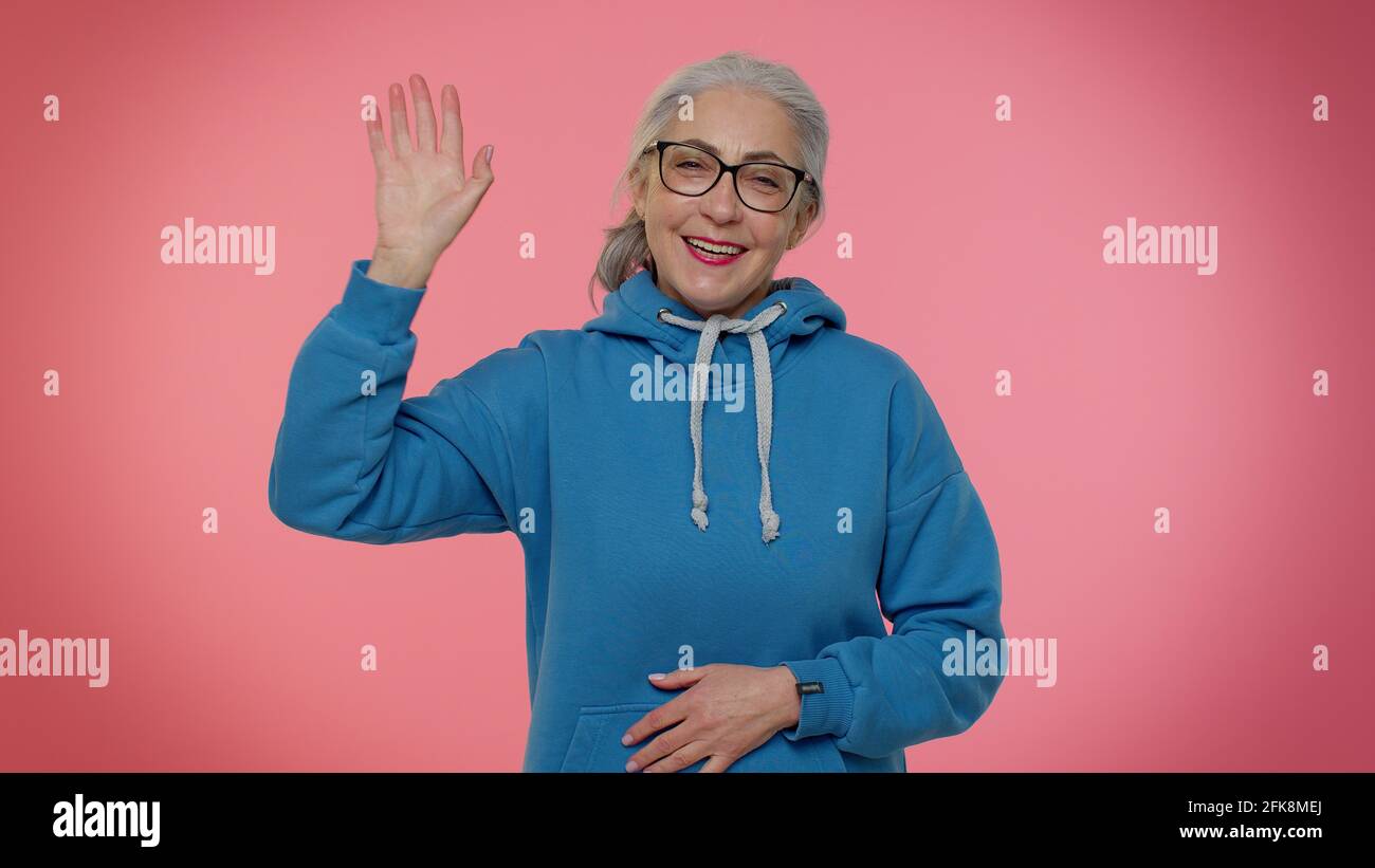 Mature woman waving funny hi-res stock photography and images - Alamy