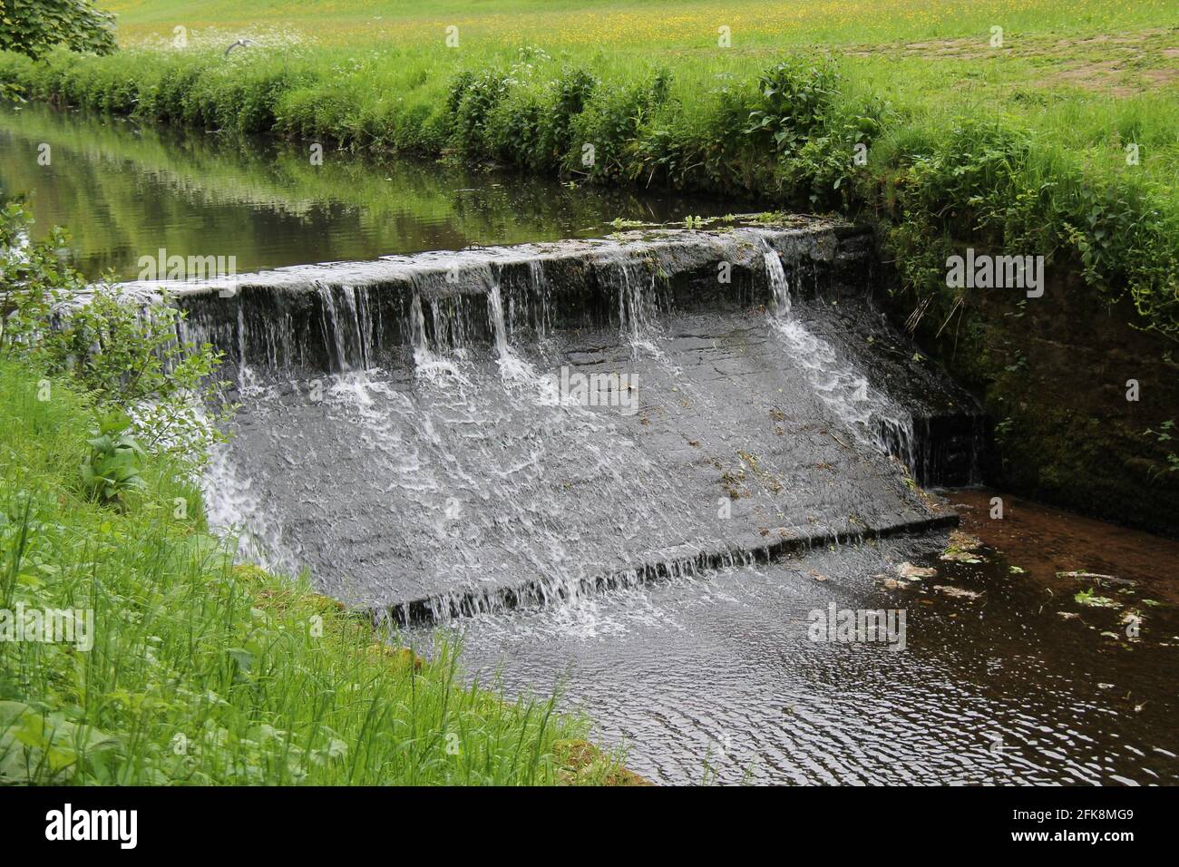 A Weir and Waterfall on a Small Country River Stock Photo - Alamy