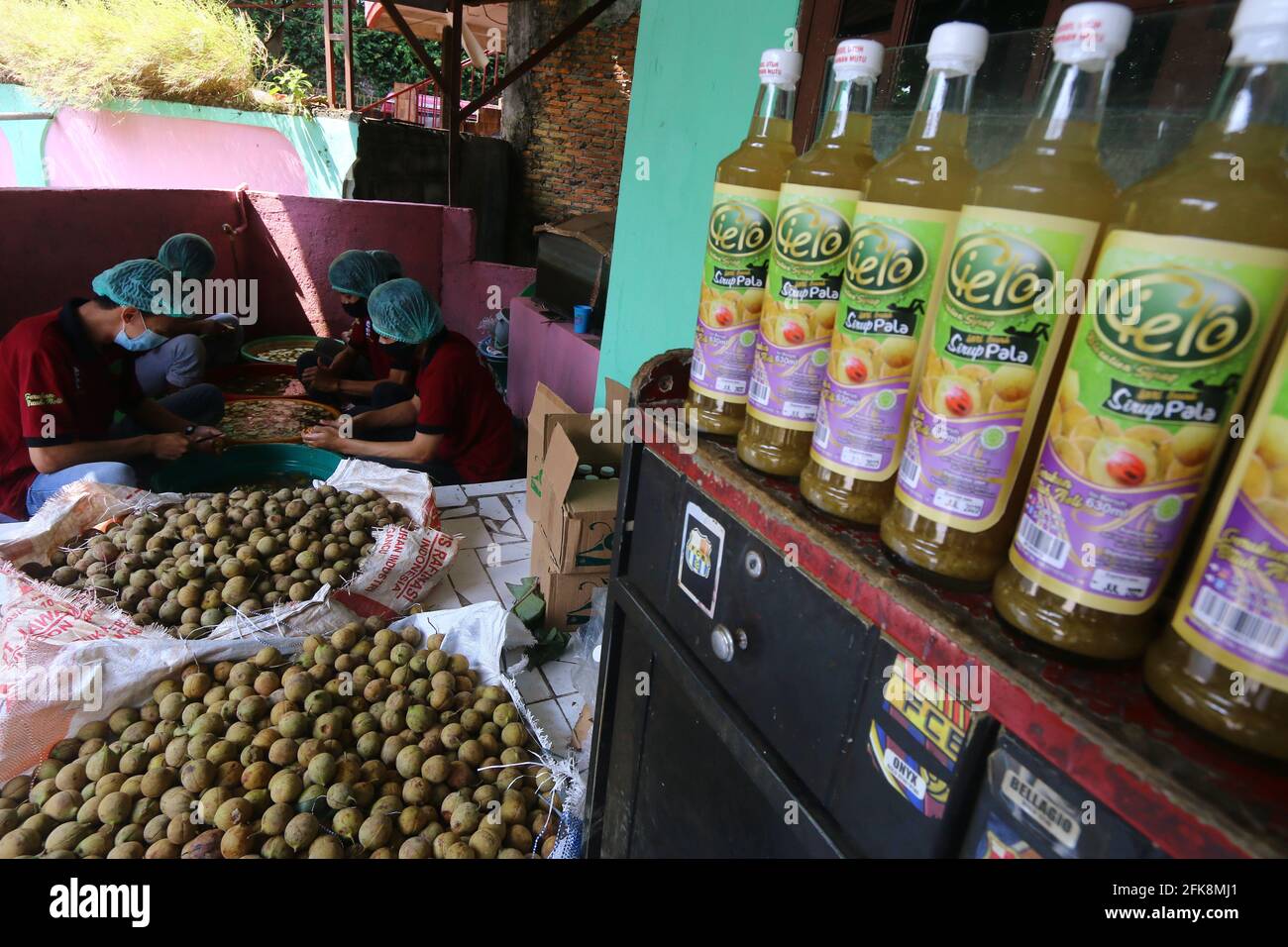 workers make a syrup drink from nutmeg Stock Photo - Alamy