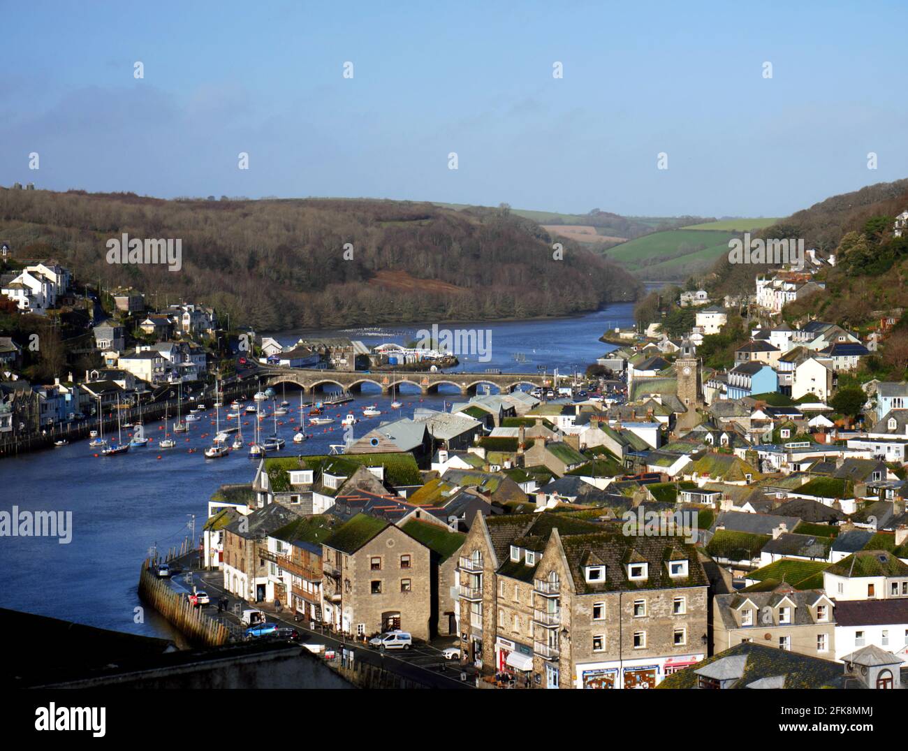 The seven-arched bridge across the Looe River, Cornwall, and the town ...