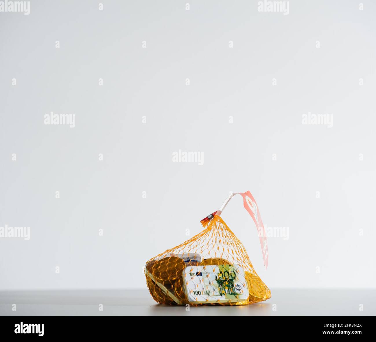 net pack with multiple chocolate Euros coins Stock Photo - Alamy