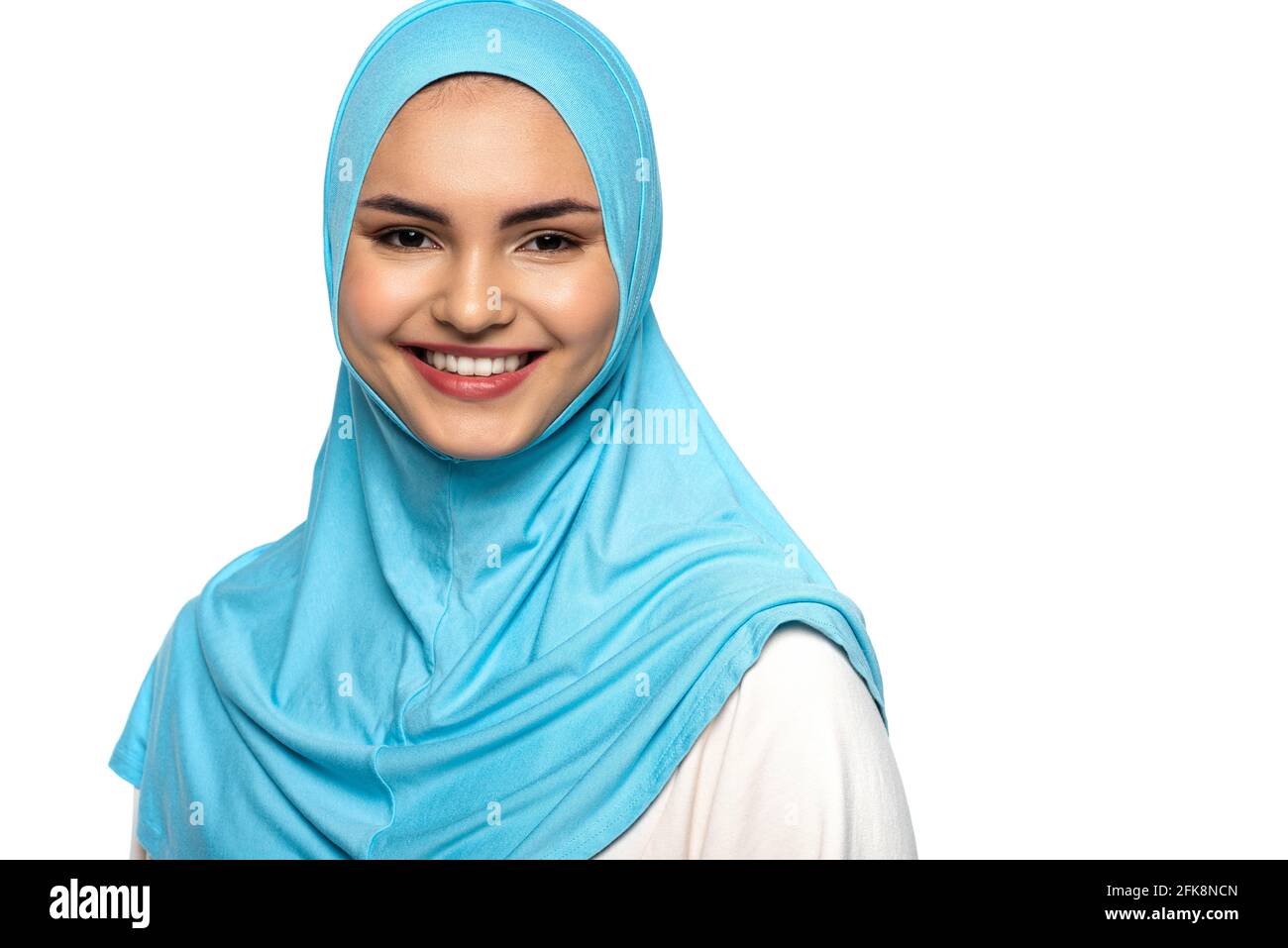 Muslim woman in hijab smiling at camera isolated on white Stock Photo ...