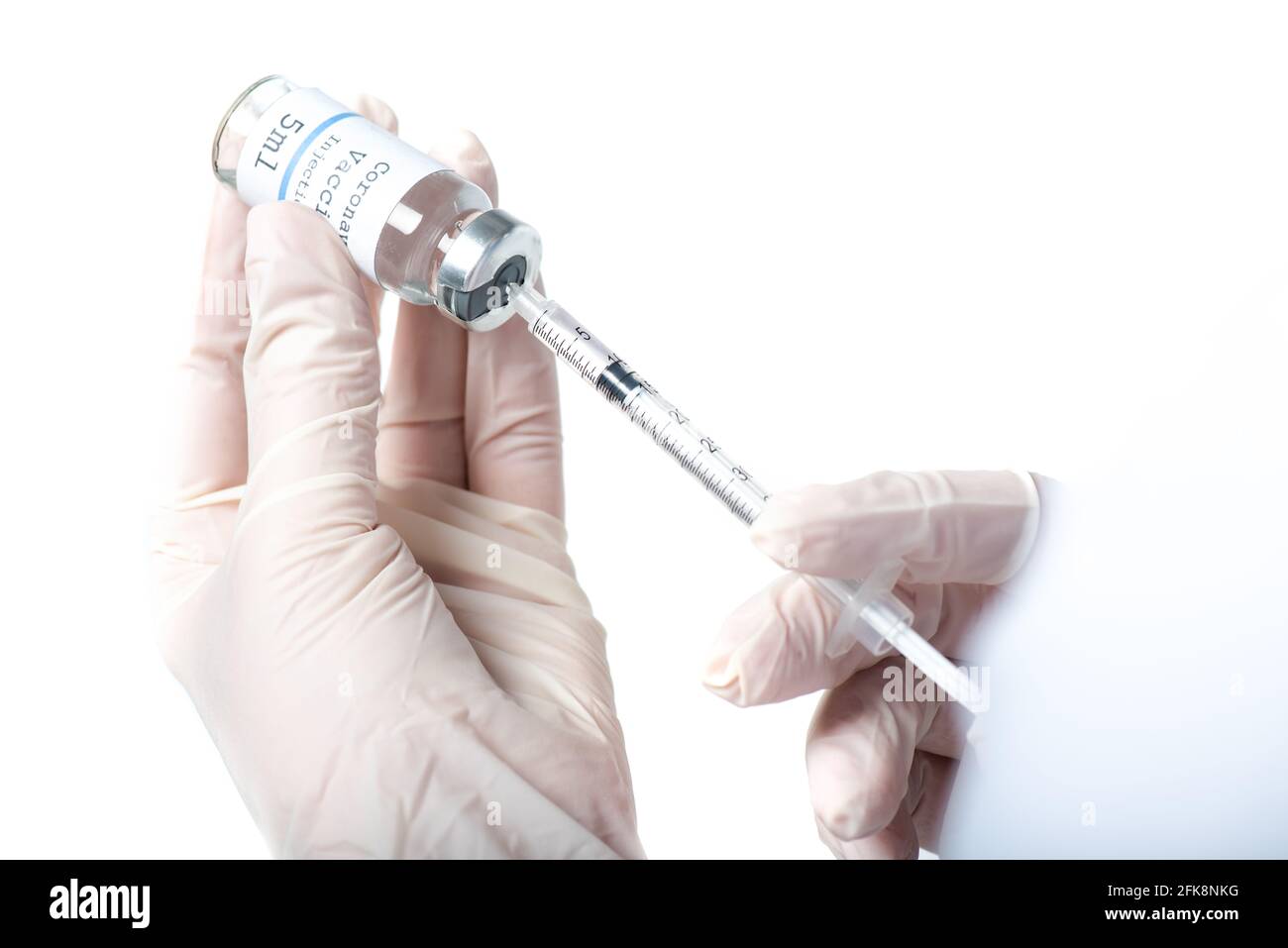 Doctor picking up medication syringe hi-res stock photography and ...