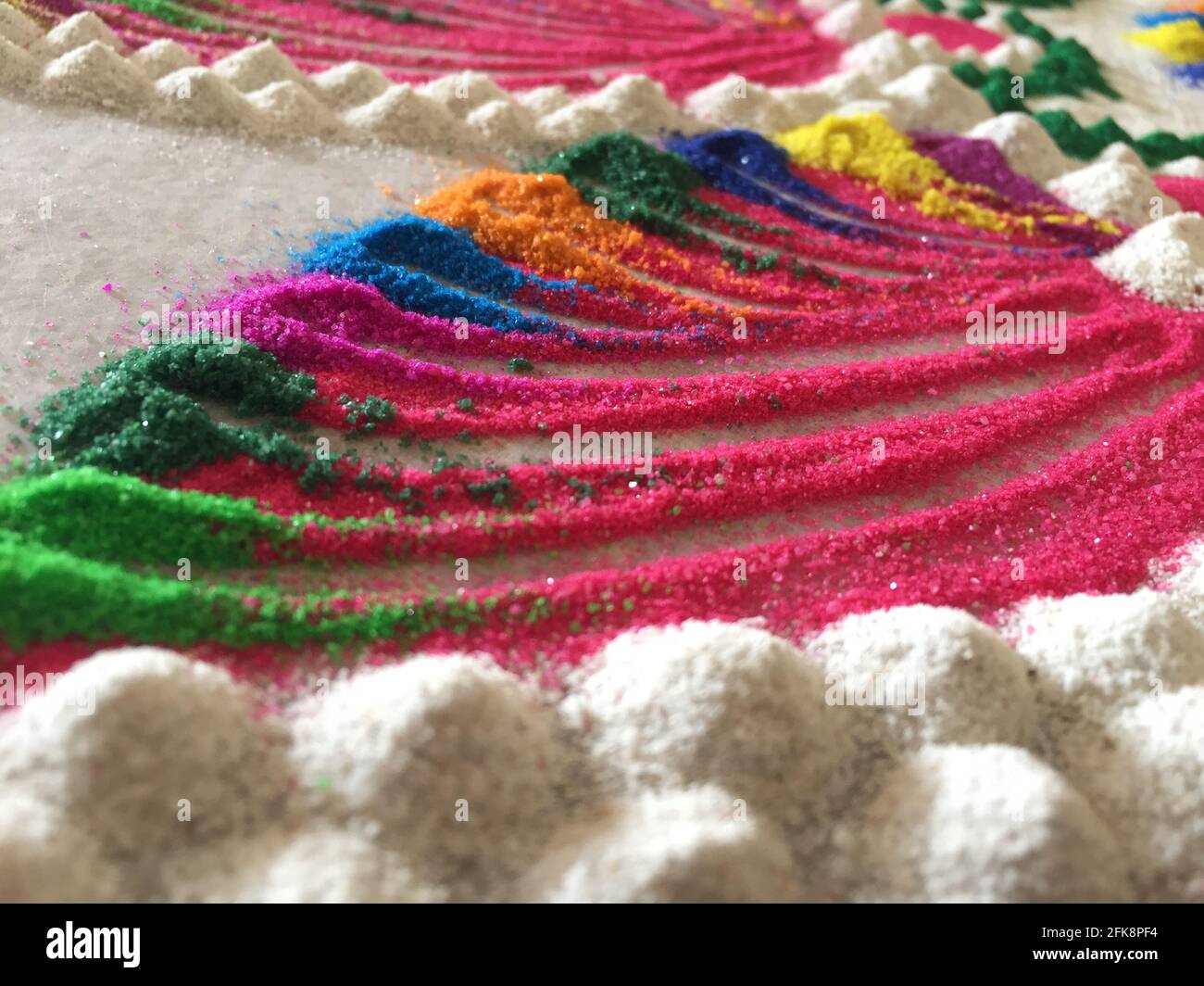 Closeup of different patterns made out of colorful sand Stock Photo - Alamy
