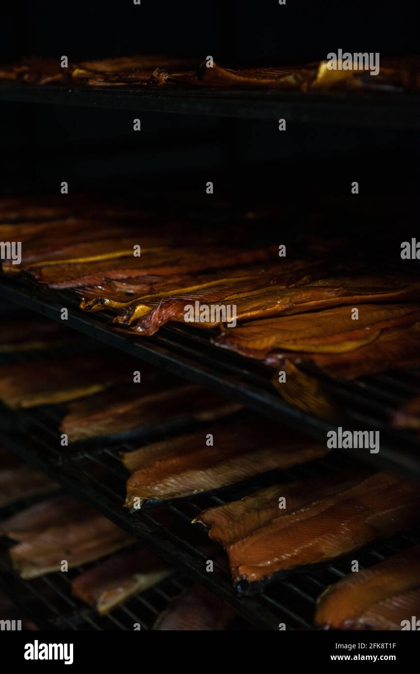 Smoked fish production concept: smoked fish in smokehouse box Stock ...