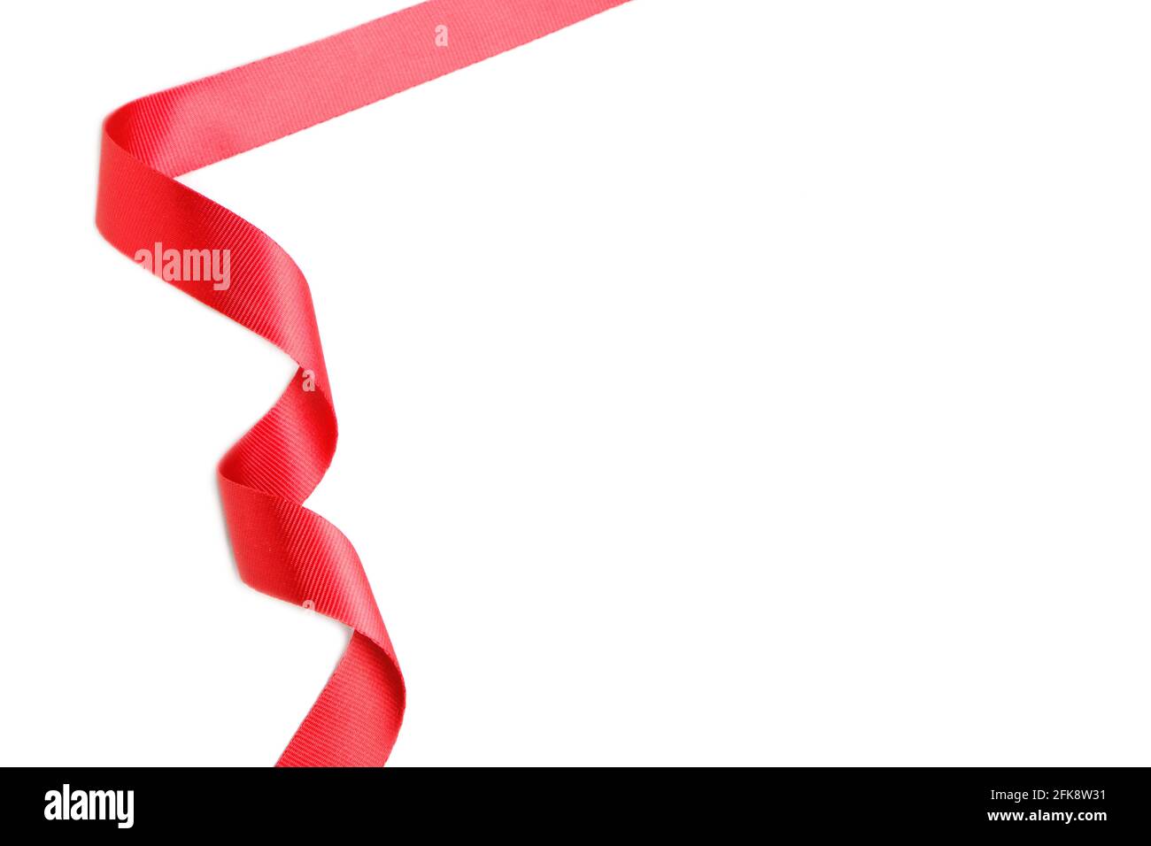 Red ribbon twisted in a spiral on a white background Stock Photo - Alamy