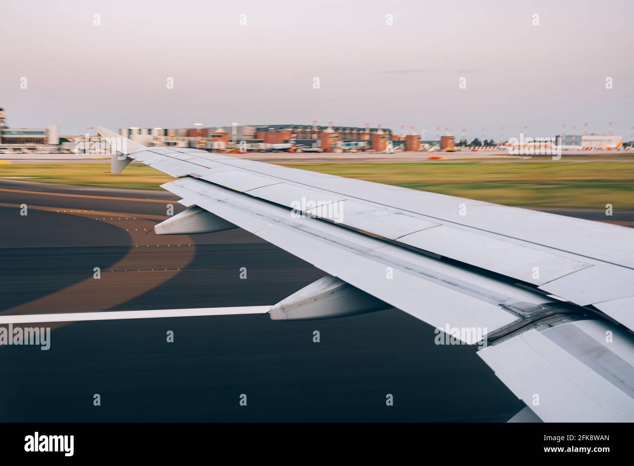 Landing on the runway. View from the porthole Stock Photo - Alamy