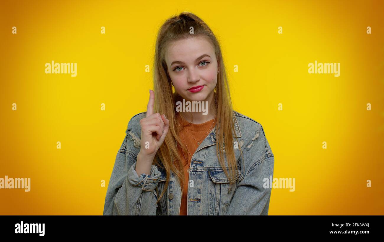 Girl shakes finger and saying no, be careful, scolding, giving advice ...