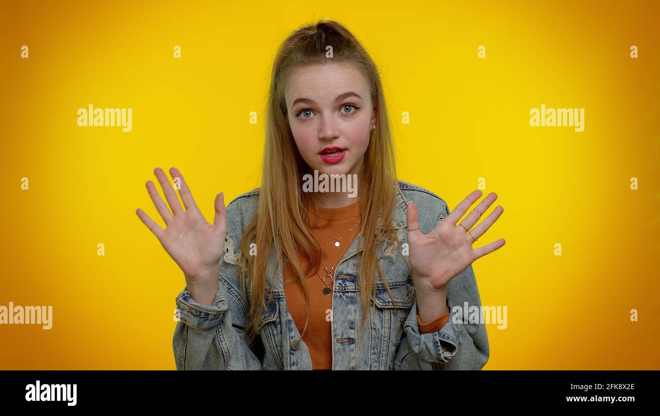 Teenager girl warning with admonishing finger gesture, saying no, be ...