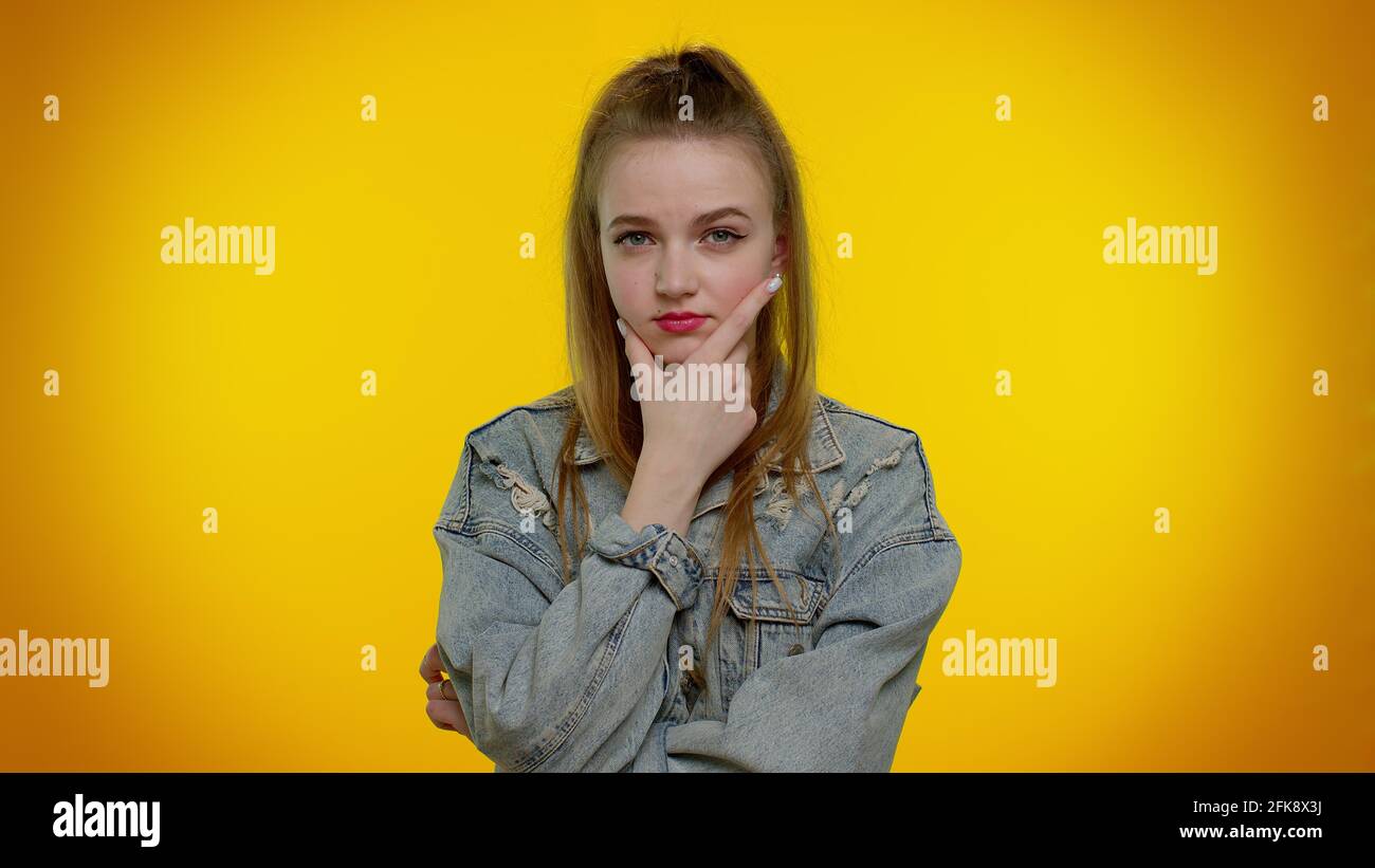 Doubting pensive girl pondering and imagining in mind, wondering ...