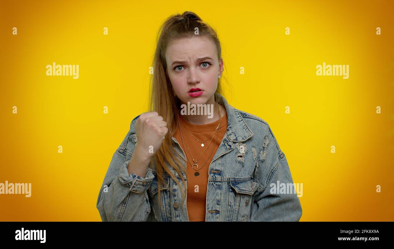 Aggressive angry girl trying to fight at camera, shaking fist, boxing ...