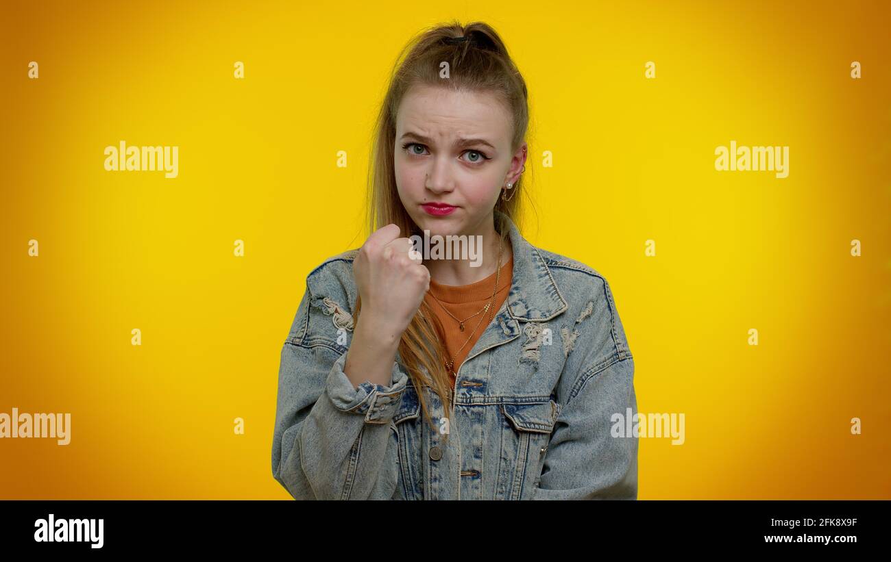 Aggressive angry girl trying to fight at camera, shaking fist, boxing ...
