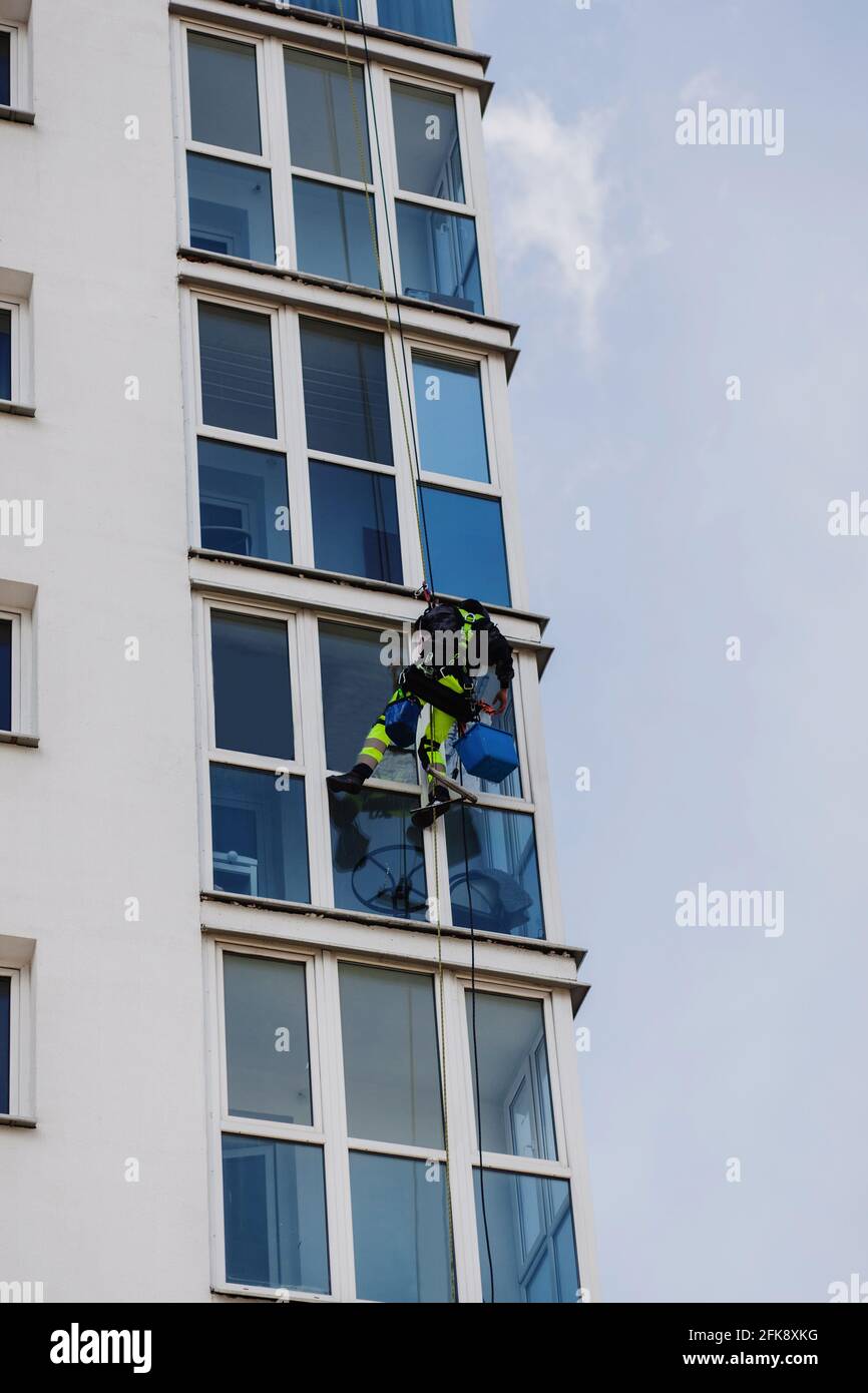 Window washers on a office building. Industrial climbing - facade ...