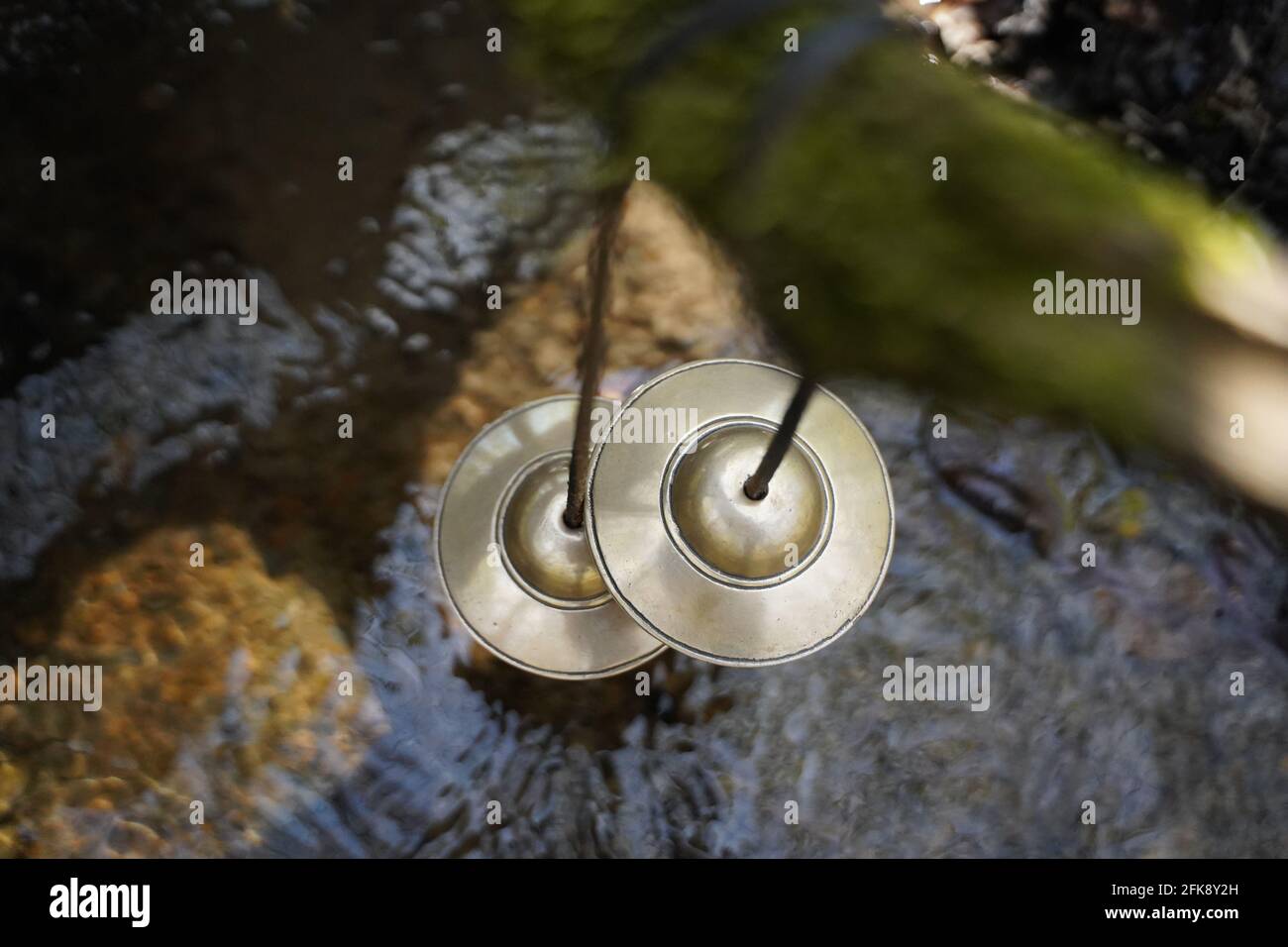 Cymbals close up for sound healing therapy Stock Photo - Alamy
