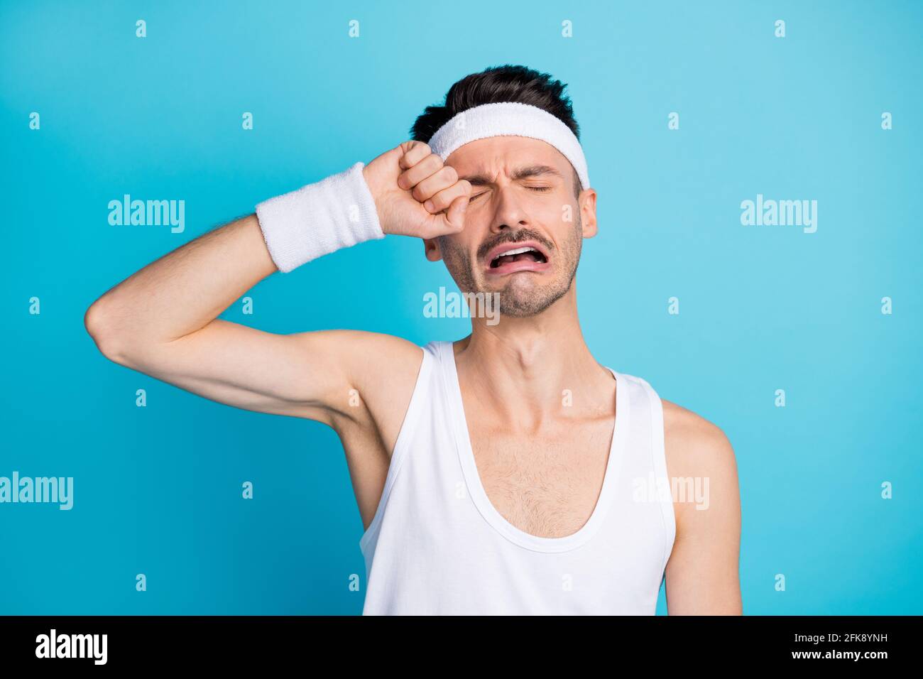 Photo of stressed sporty guy touch eye hand cry no crossfit gym result ...