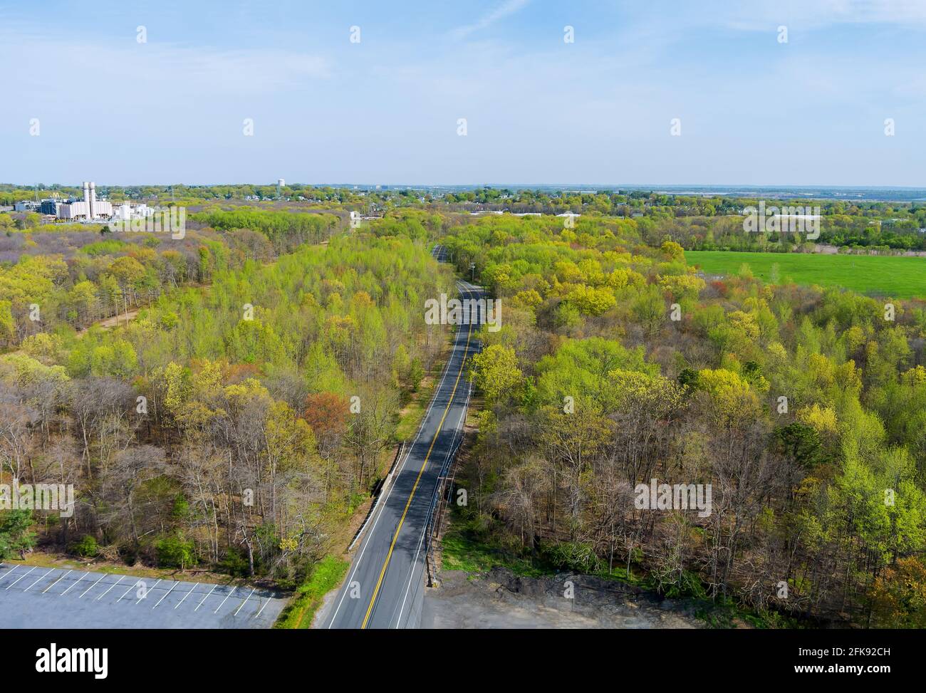 Aerial panoramic view of a highway road in the middle of the forest ...