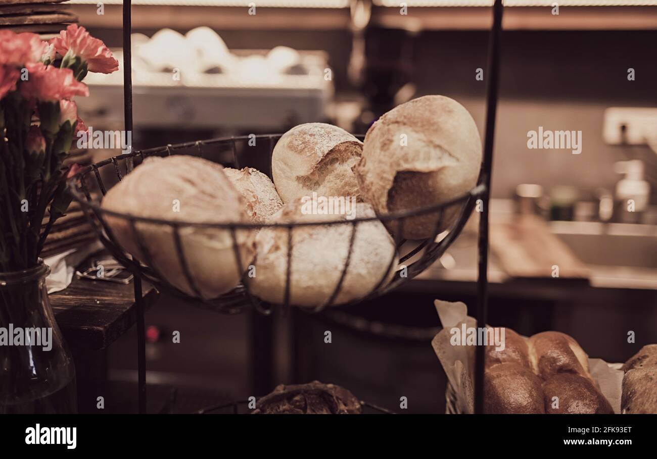 fresh baked goods in the window of a bakery or store Stock Photo - Alamy