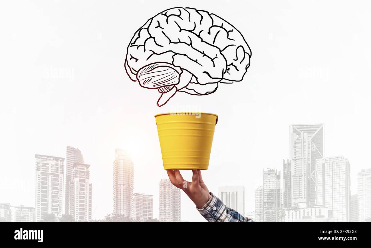 Brain drawing flying above yellow pot Stock Photo - Alamy