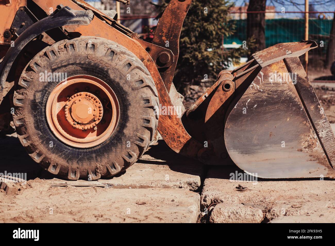 large excavator with a bucket at construction site Stock Photo - Alamy