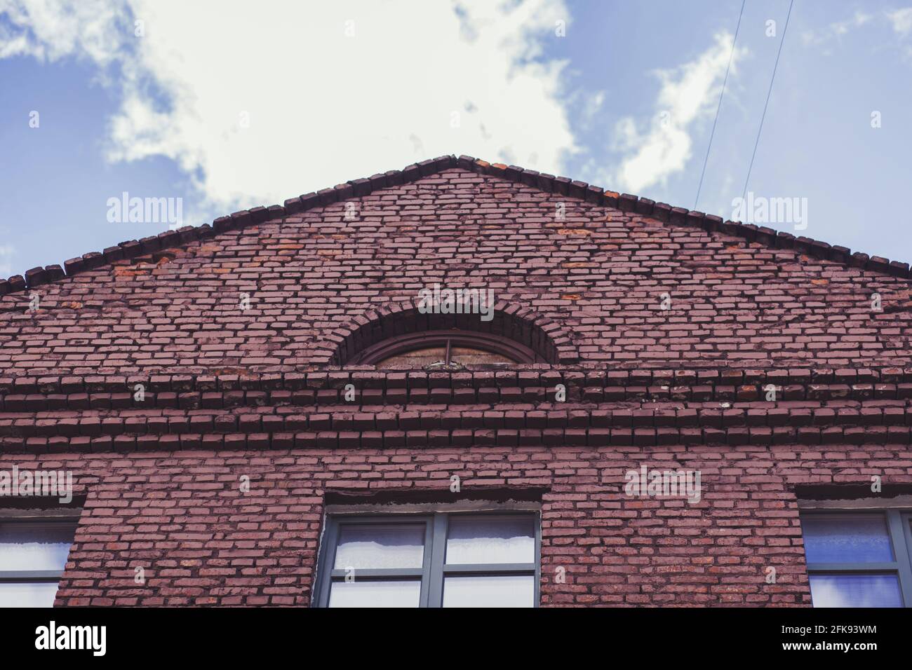 Administrative building. Brick building with windows on sky background ...