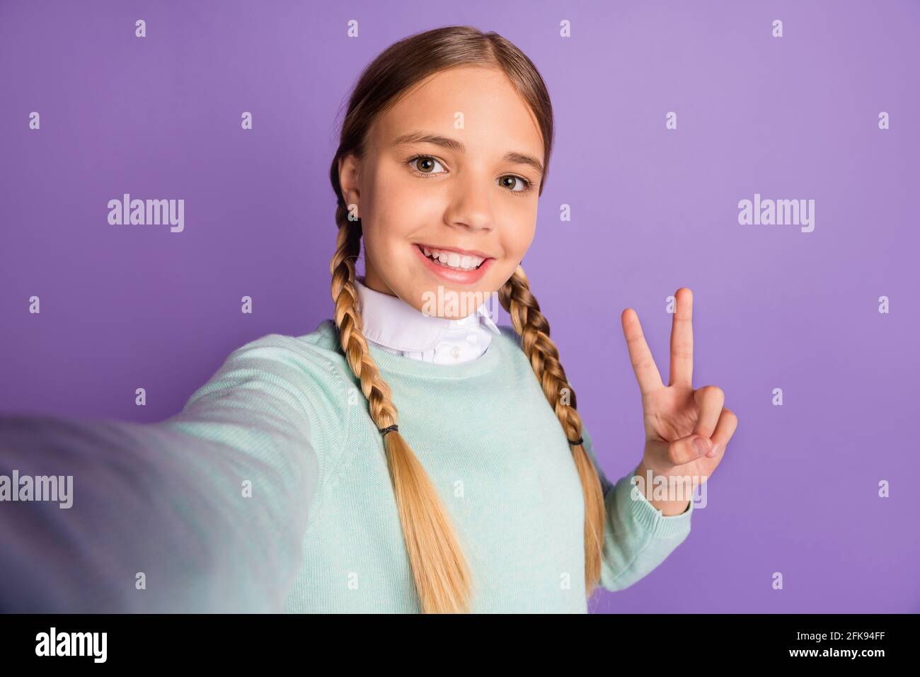 Photo of little funny lady beaming smile show v-sign take selfie wear ...