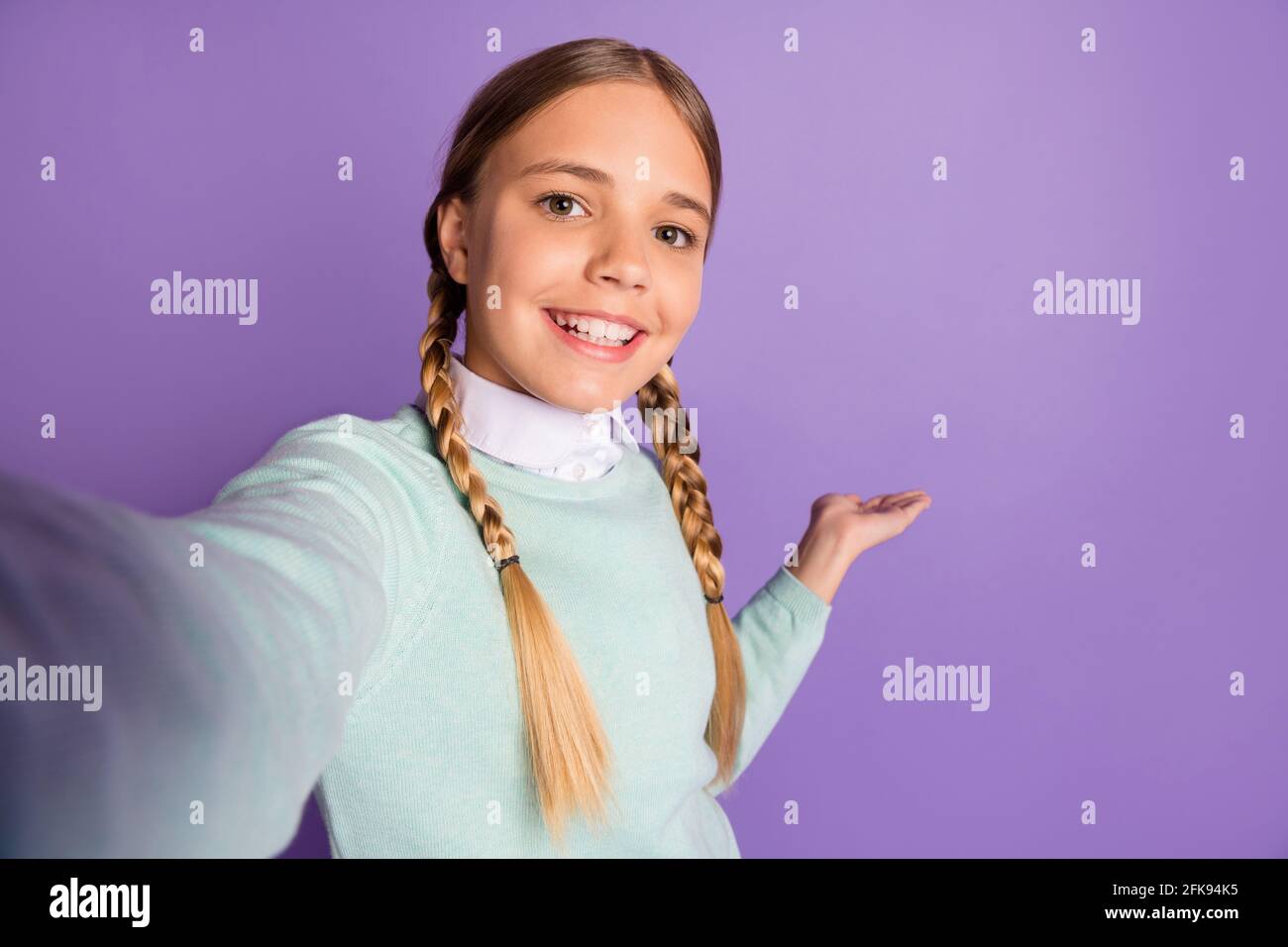 Photo of small lady shiny smile shoot selfie palm show empty space wear ...