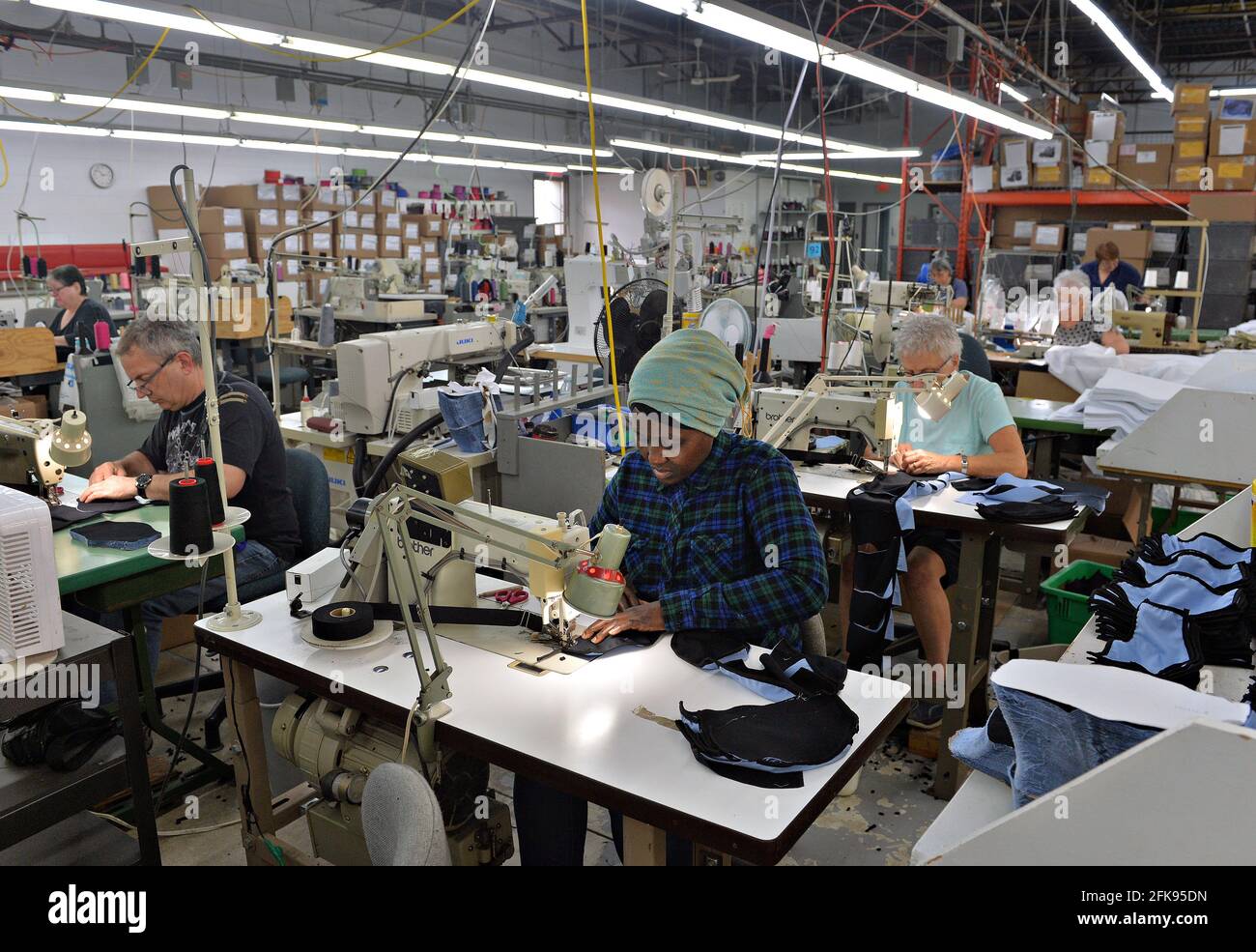 Women stitching clothes hi-res stock photography and images - Alamy