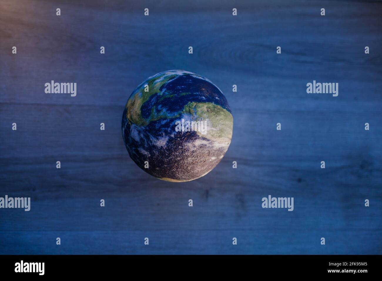 reduced model of the earth. round planet lamp Stock Photo - Alamy