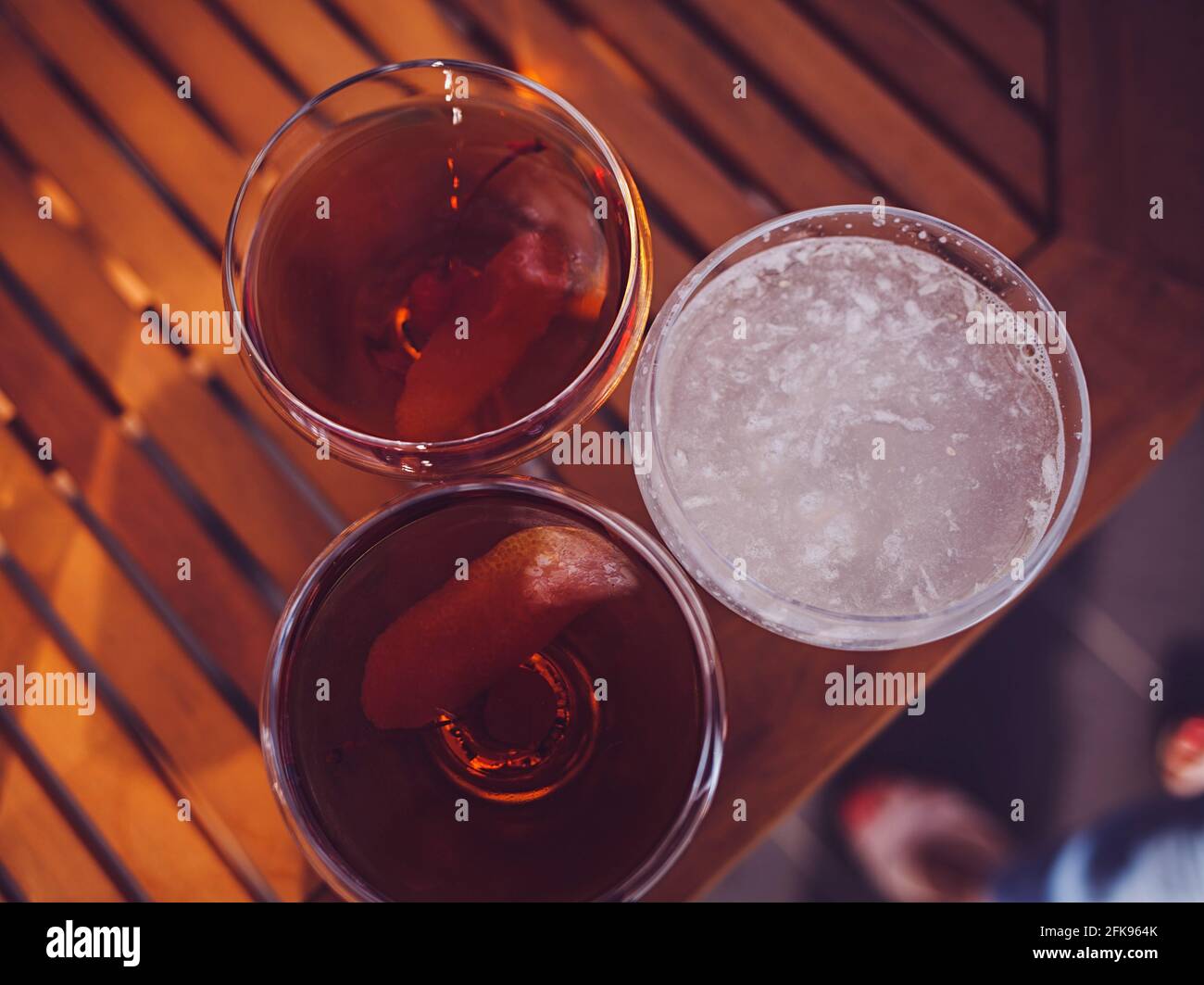 three alcoholic cocktails on the table. the view from the top Stock ...