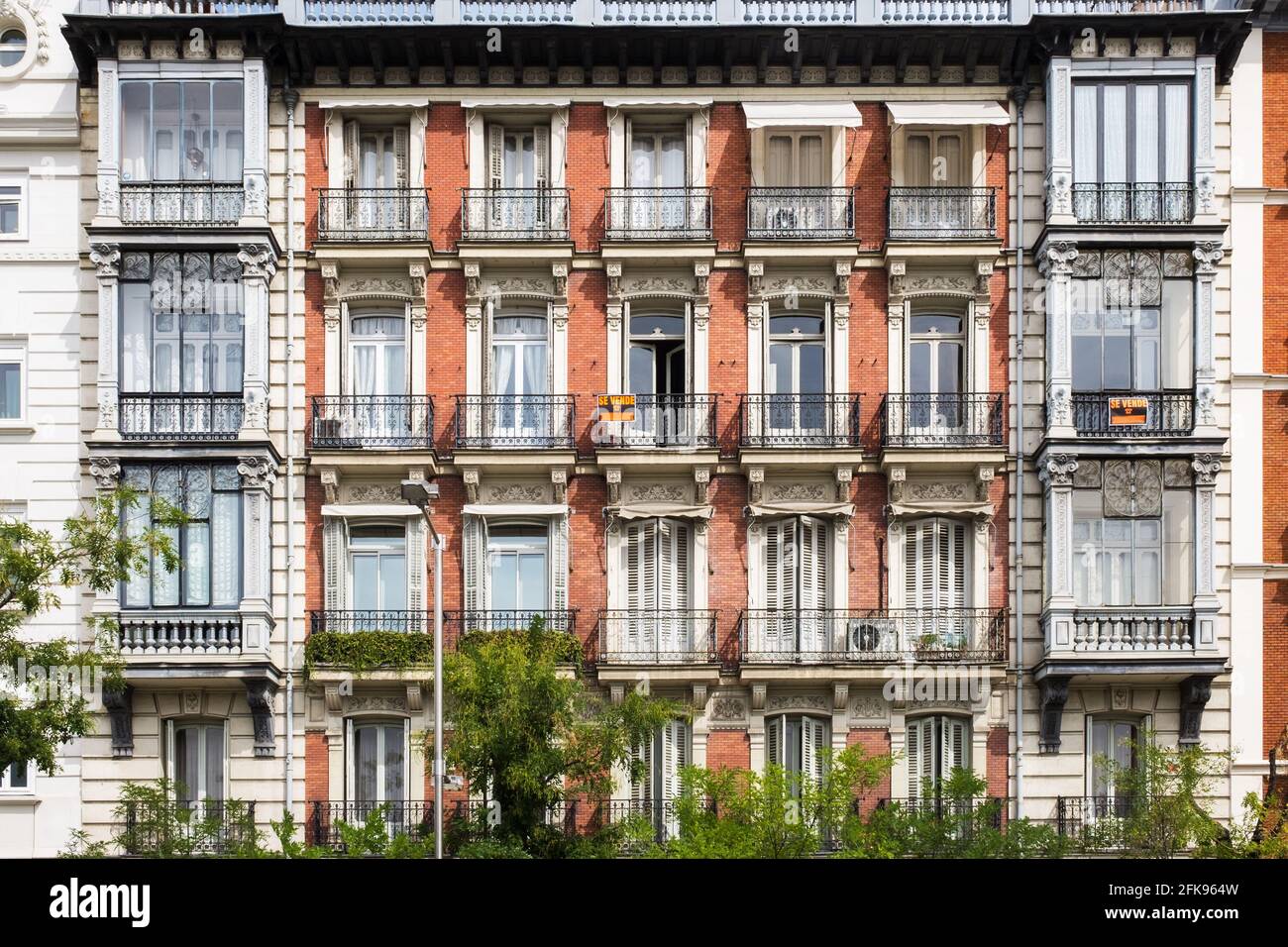 Traditional windows and balconies in Madrid’s city center Stock Photo ...