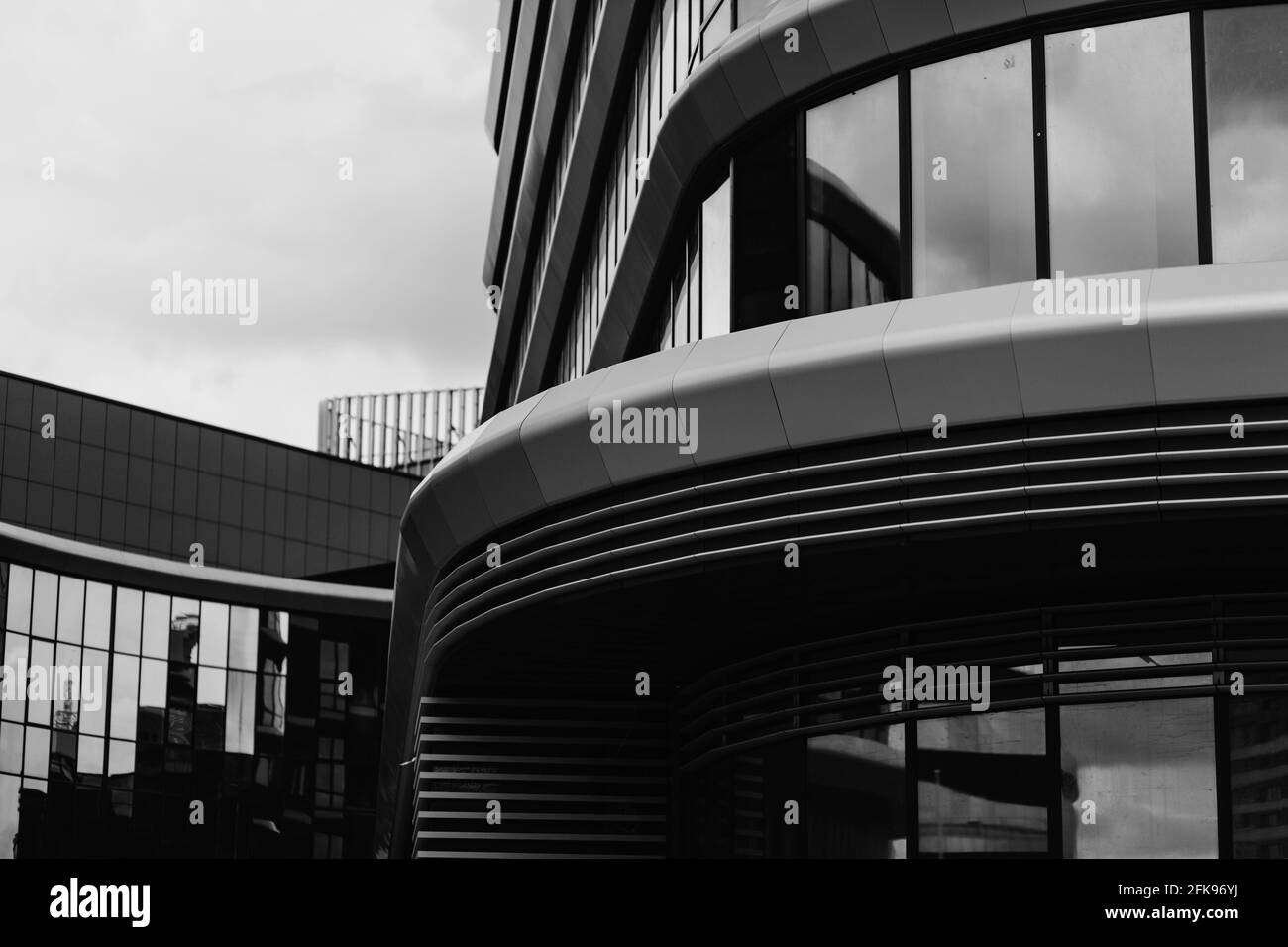 modern monochrome building with curve Stock Photo - Alamy
