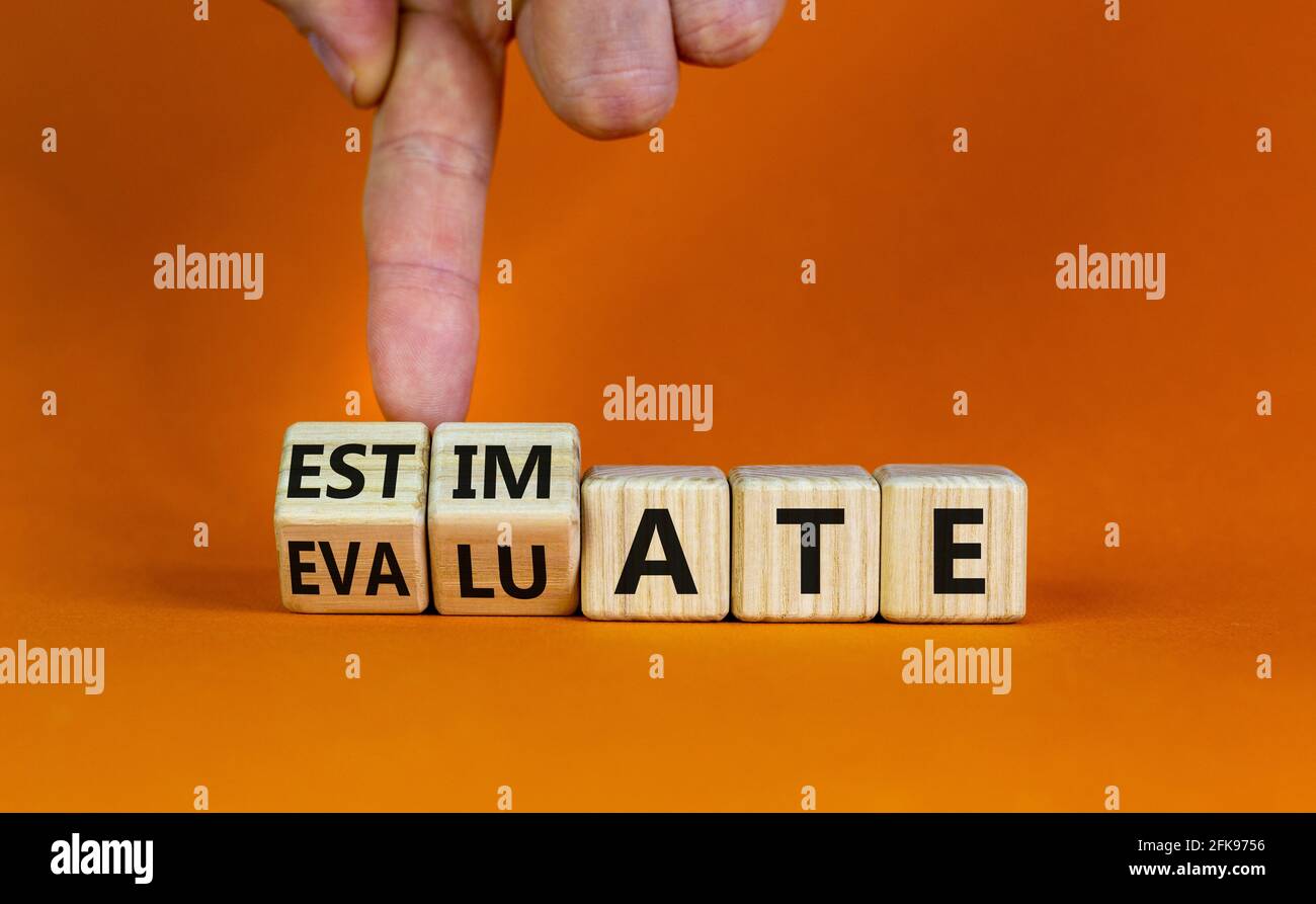 Estimate or evaluate symbol. Businessman turns wooden cubes and changes ...