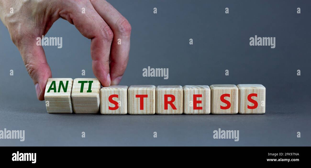 Antistress vs stress symbol. Doctor turns cubes, changes the word ...