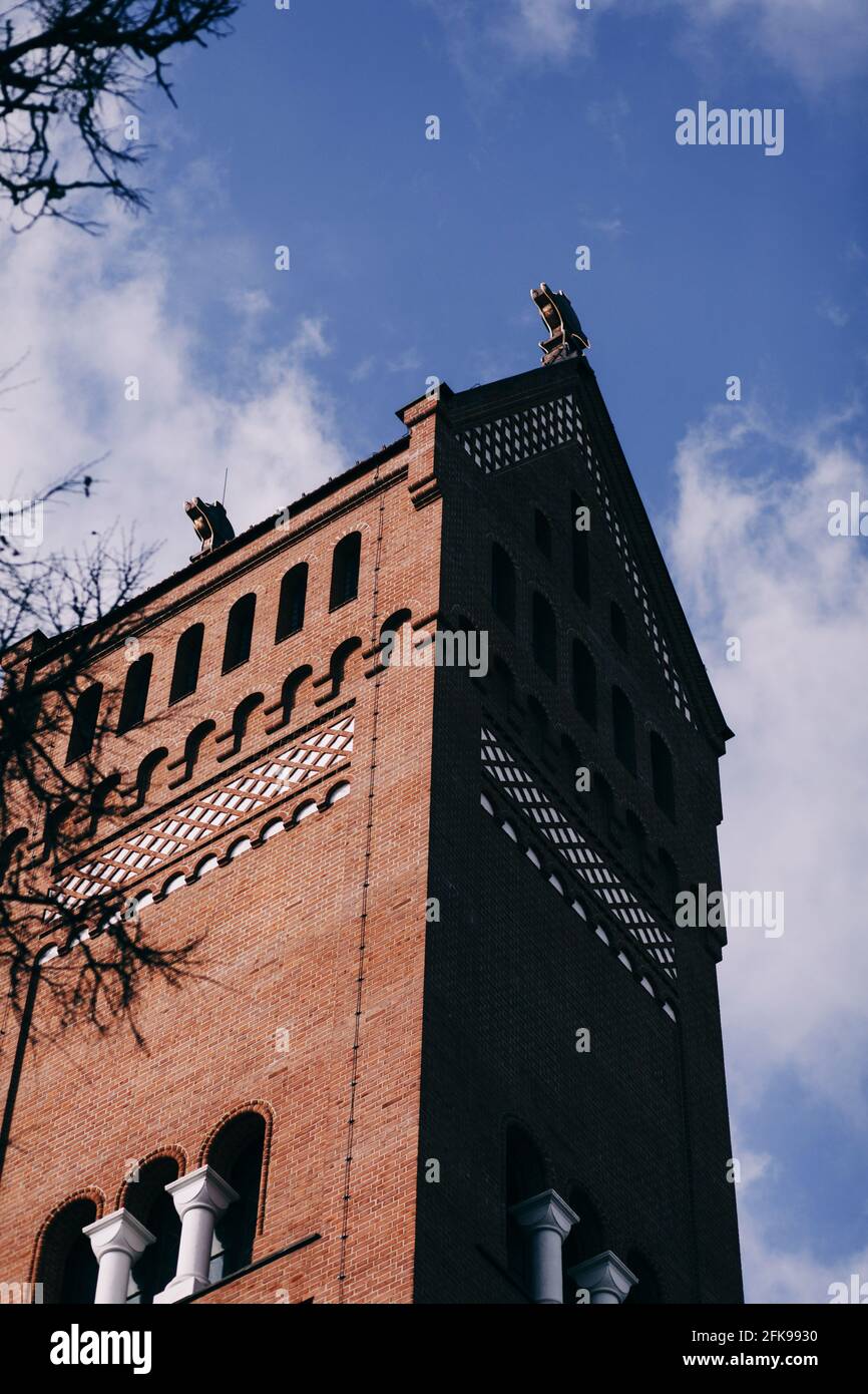 Red Catholic Church against the blue sky in Minsk Stock Photo - Alamy
